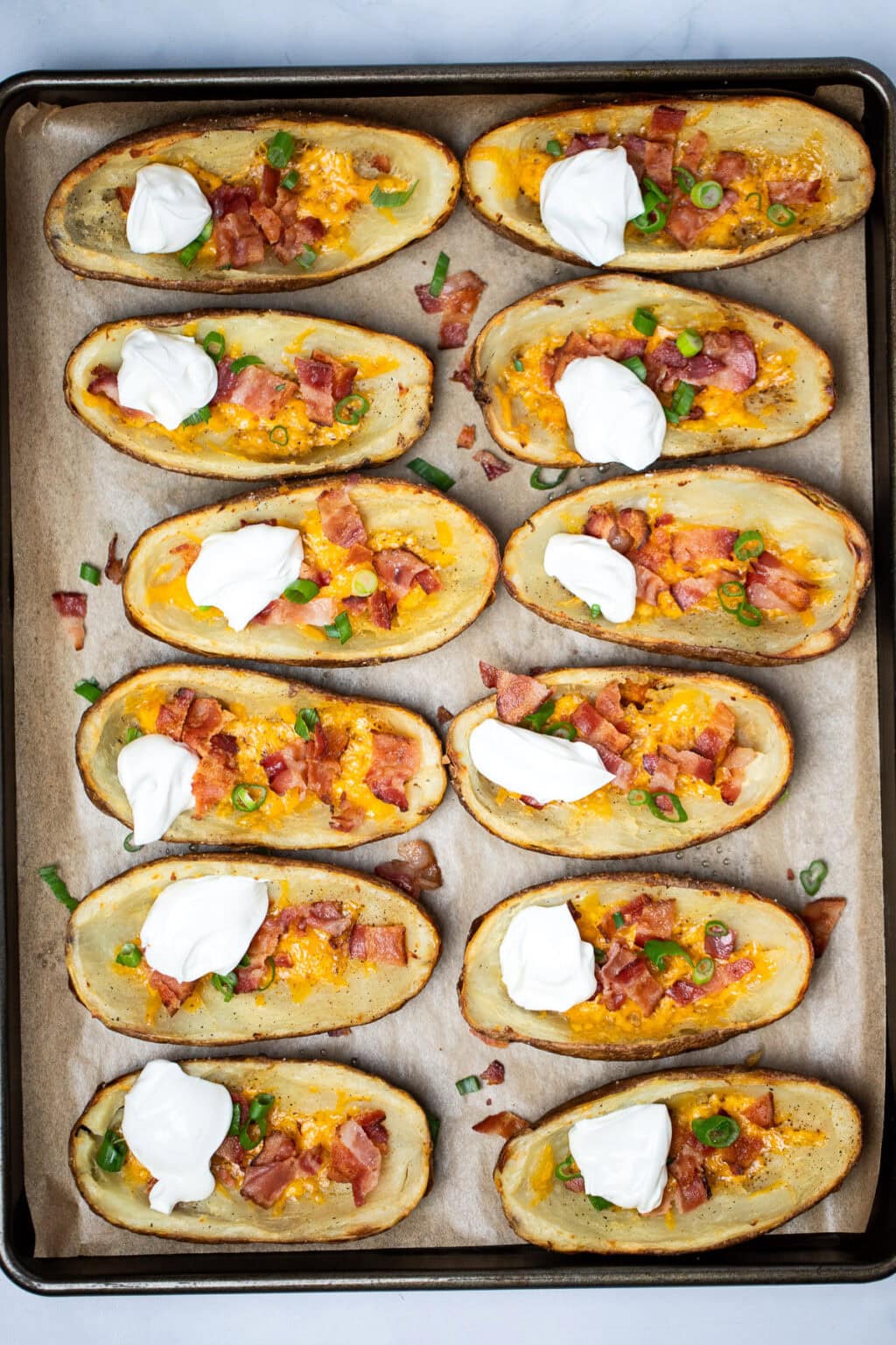 Loaded Potato Skins • Dishing Delish